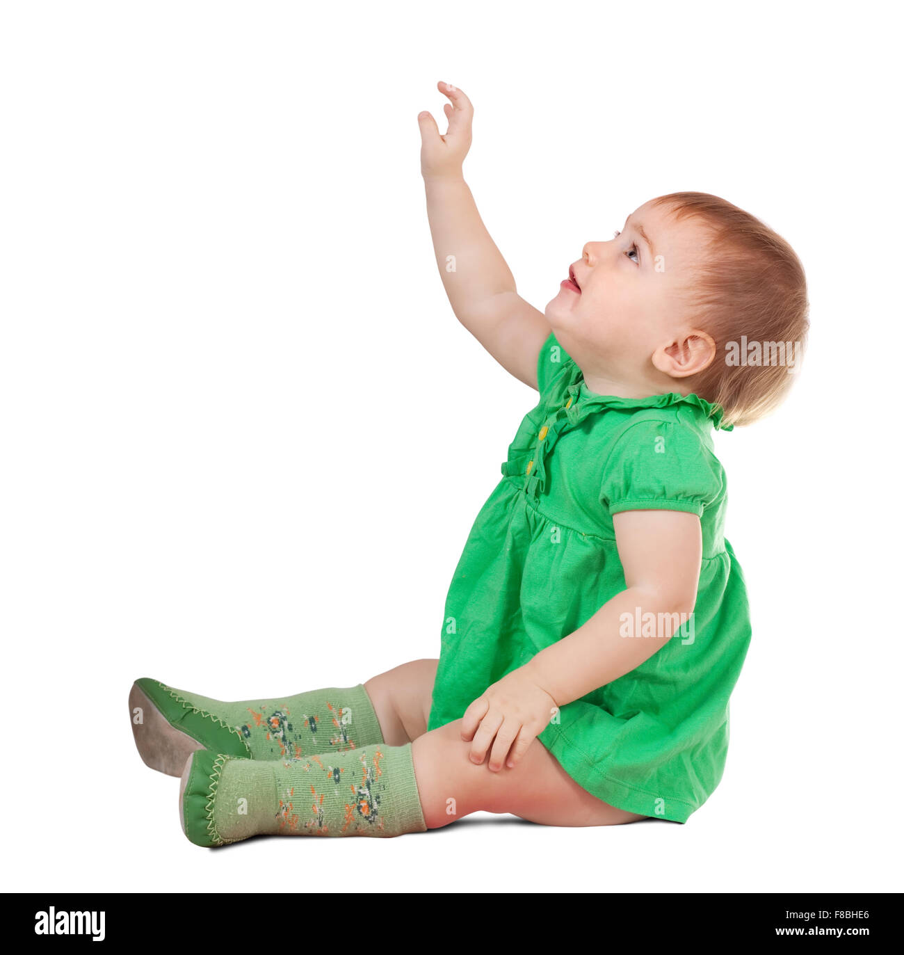 Sitting toddler. Isolated over white background with shadow Stock Photo ...