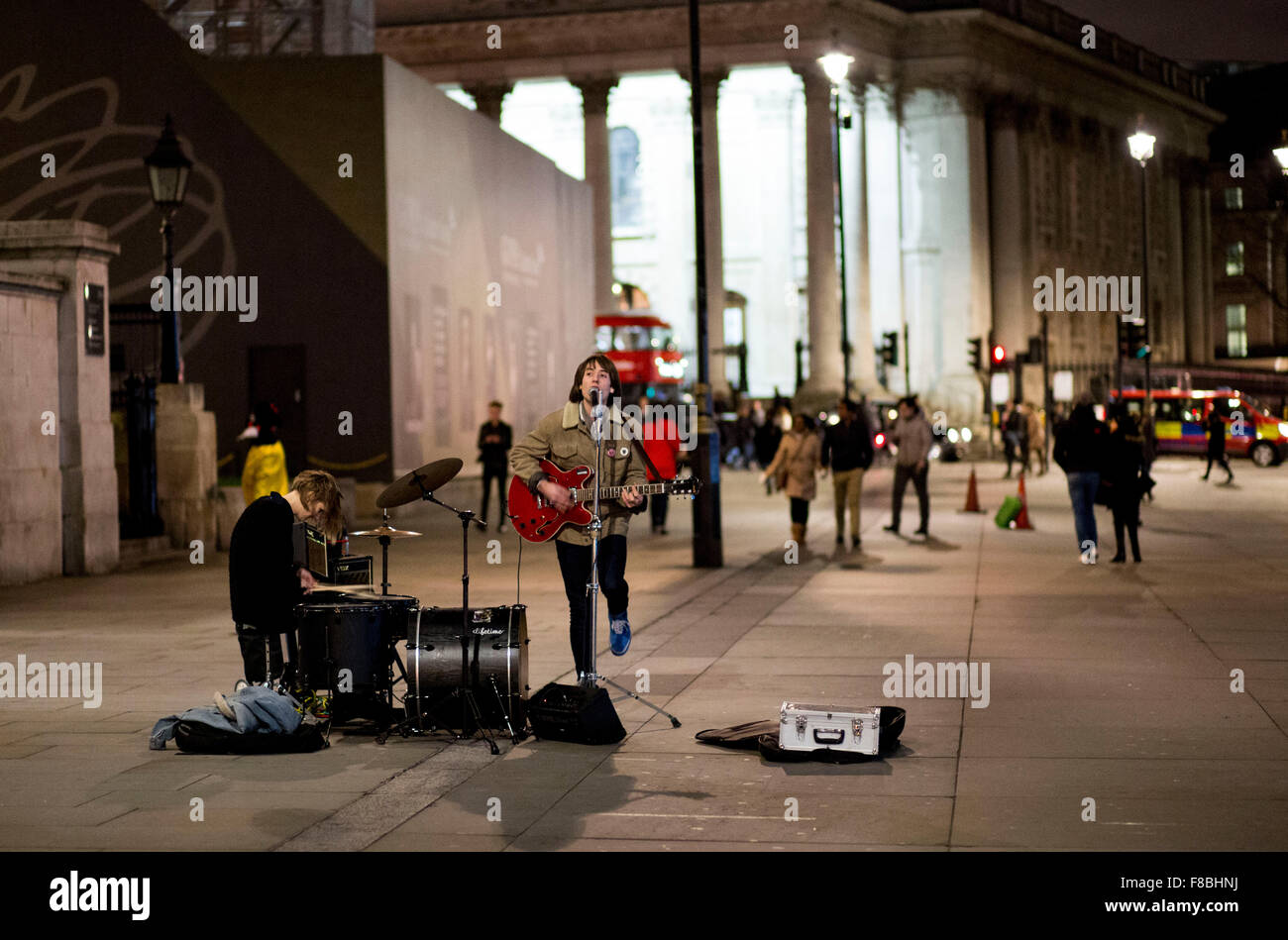 Band busking youth night drums guitar singer rock Stock Photo - Alamy