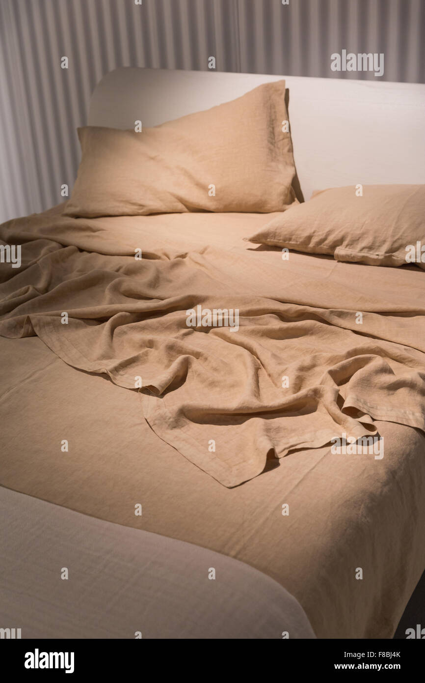 Luxury bed with crumpled sheets and a warm blanket Stock Photo - Alamy