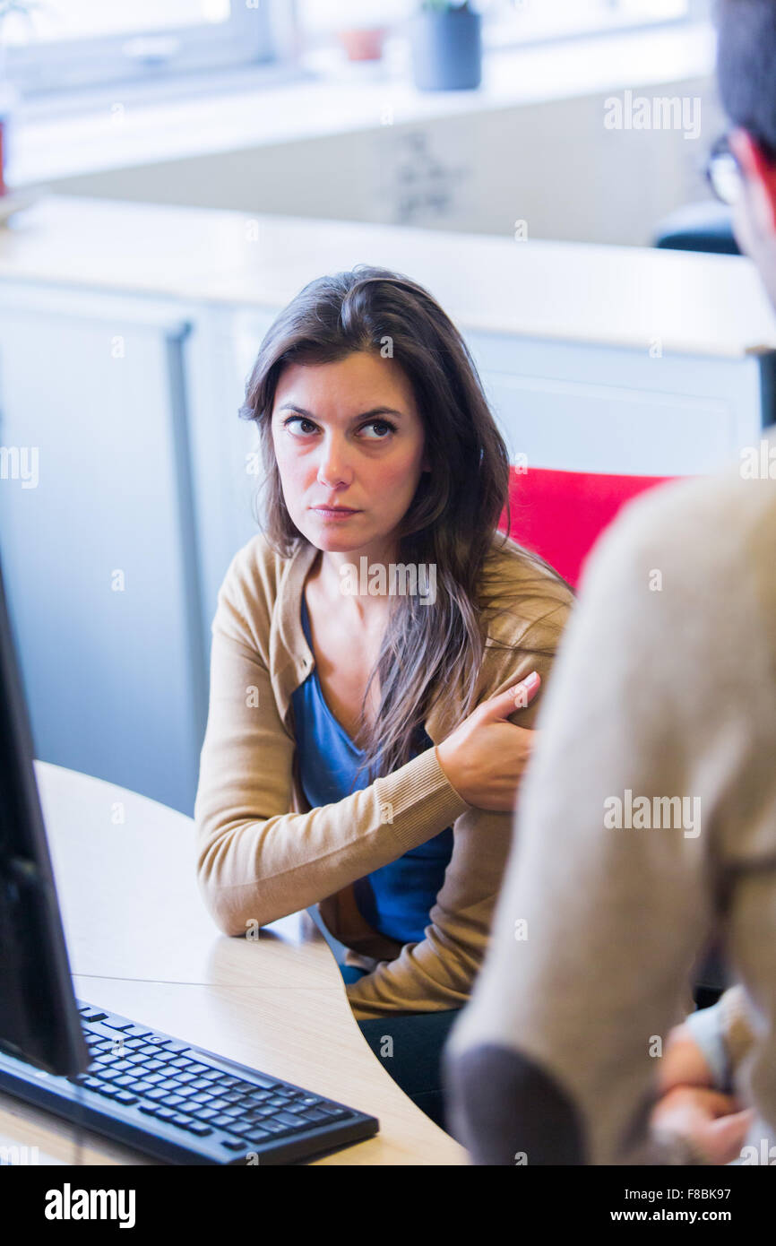 Stressed woman at work Stock Photo - Alamy