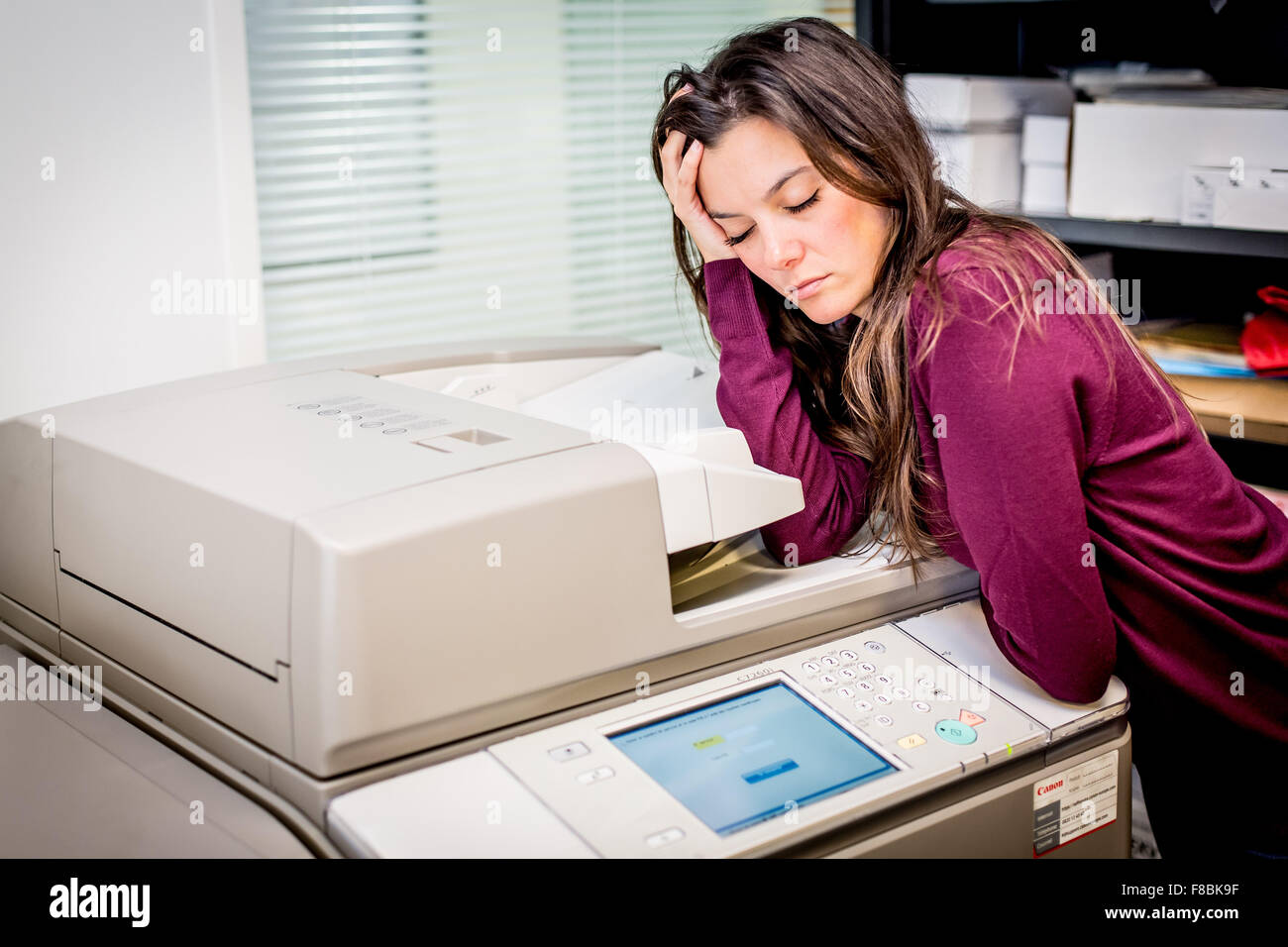 Tired woman at work Stock Photo - Alamy