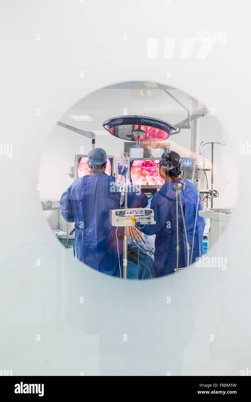 Surgical team performing prostatectomy (prostate ablation) under ...