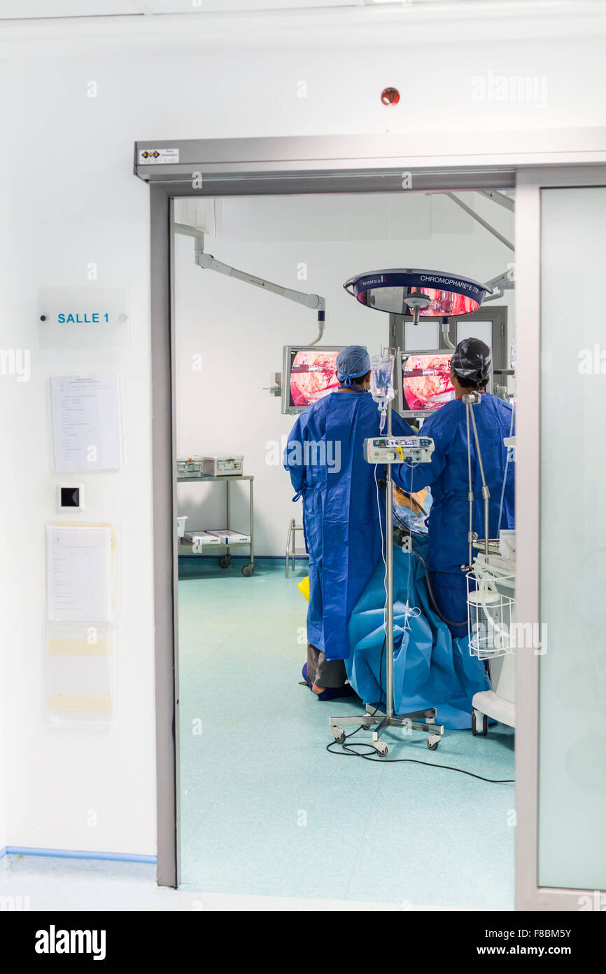 Surgical team performing prostatectomy (prostate ablation) under ...