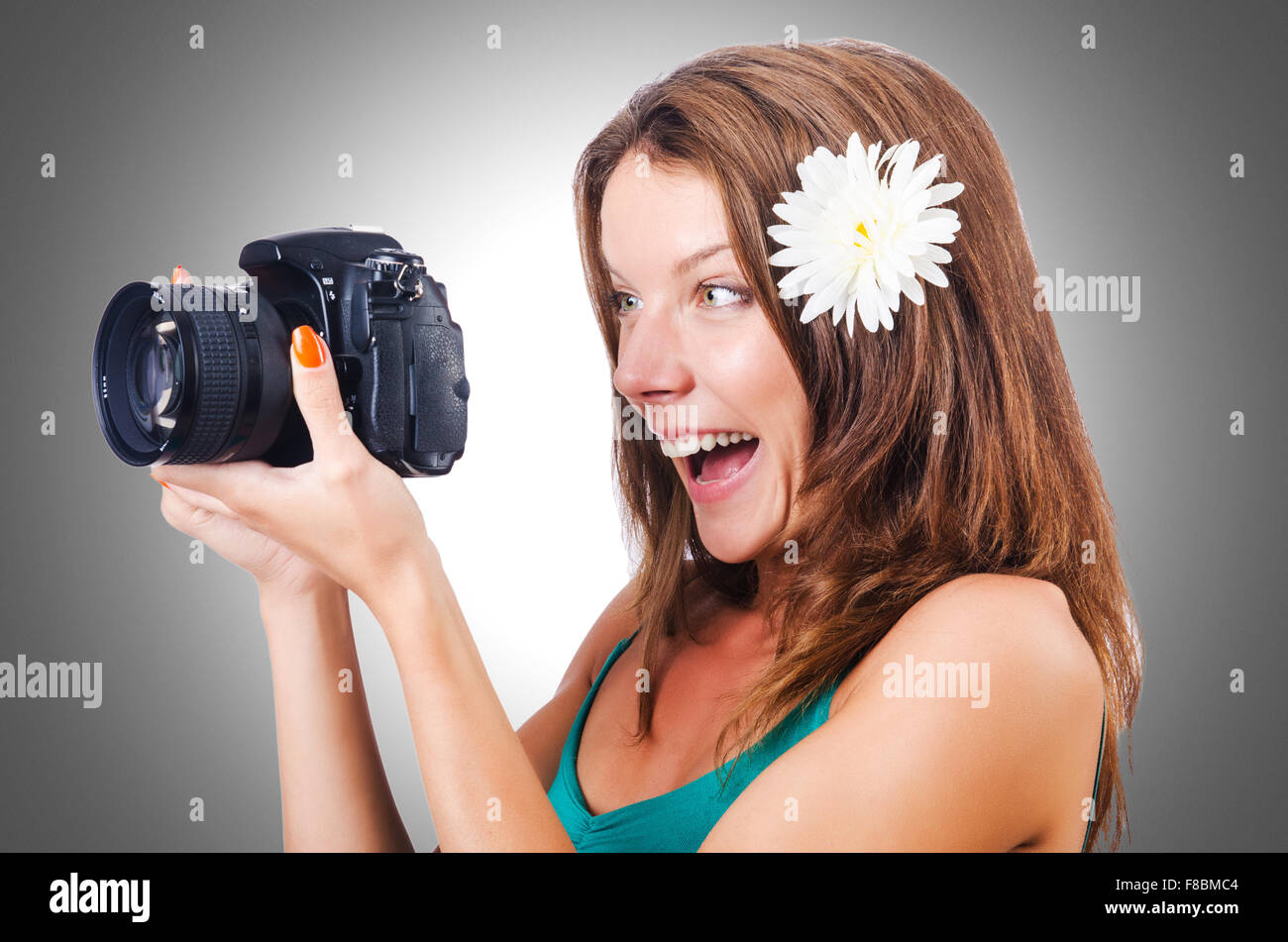 Attractive female photographer on white Stock Photo - Alamy