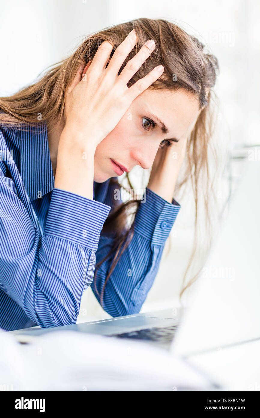 Tired woman at work Stock Photo - Alamy