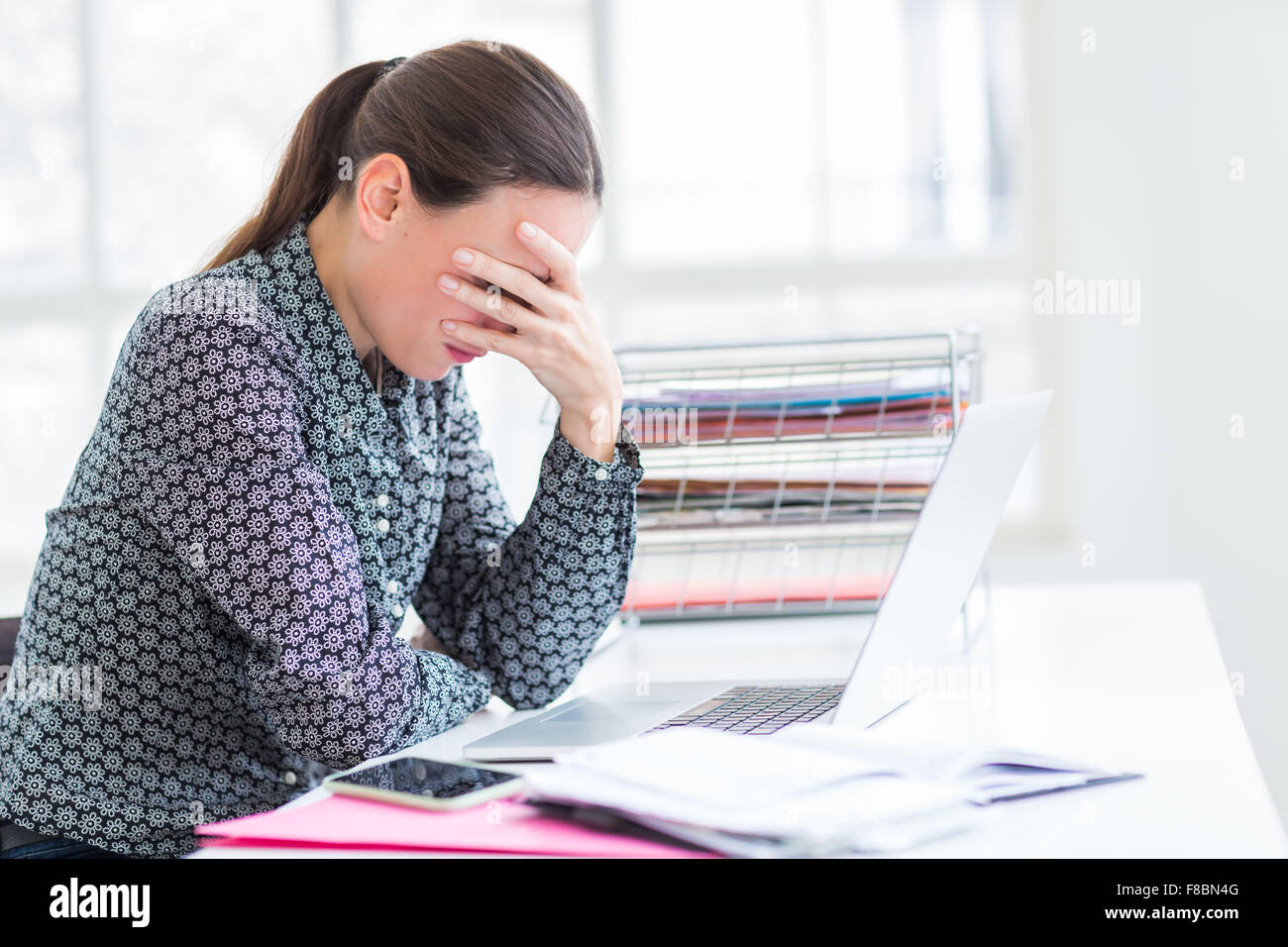 Tired woman at work Stock Photo - Alamy