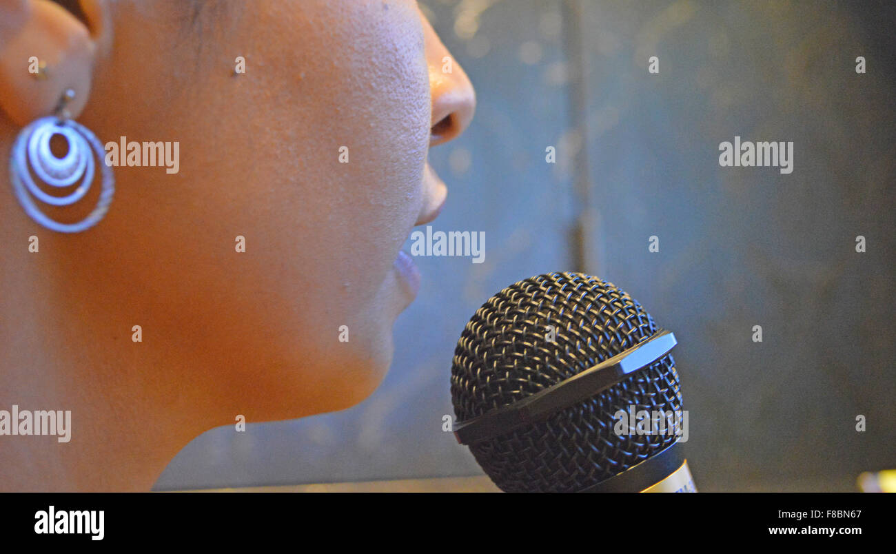 Woman singing in a Japanese karaoke Stock Photo - Alamy