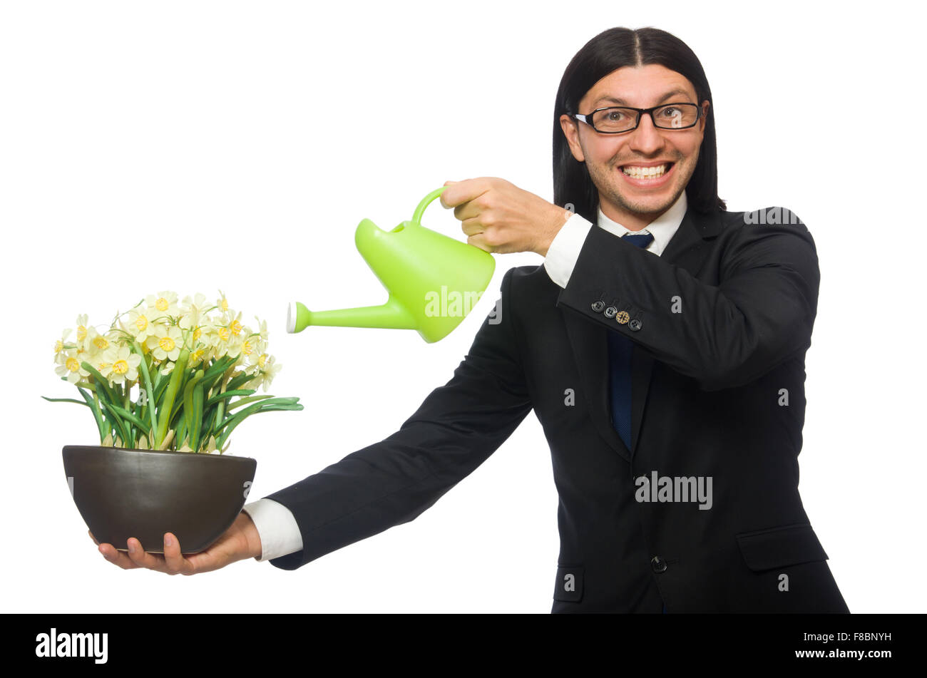 Handsome businessman holding spring flowers isolated on white Stock ...