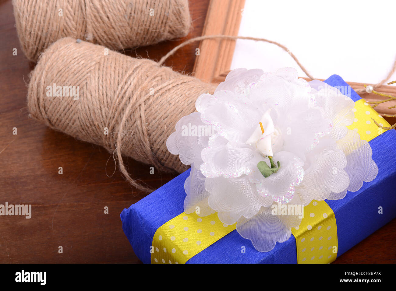 color gift boxes on wooden background Stock Photo - Alamy