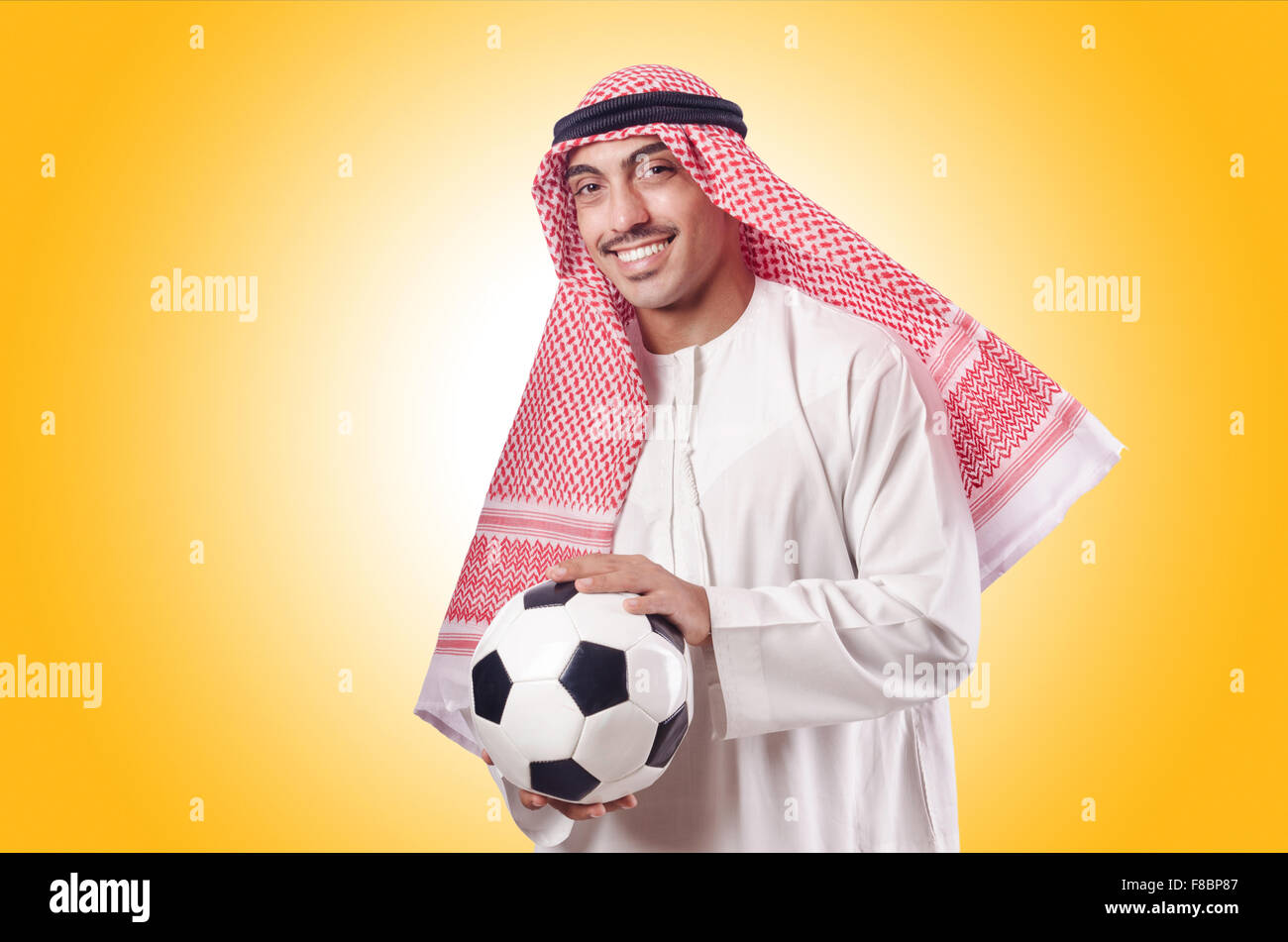 Arab man with football on white Stock Photo - Alamy