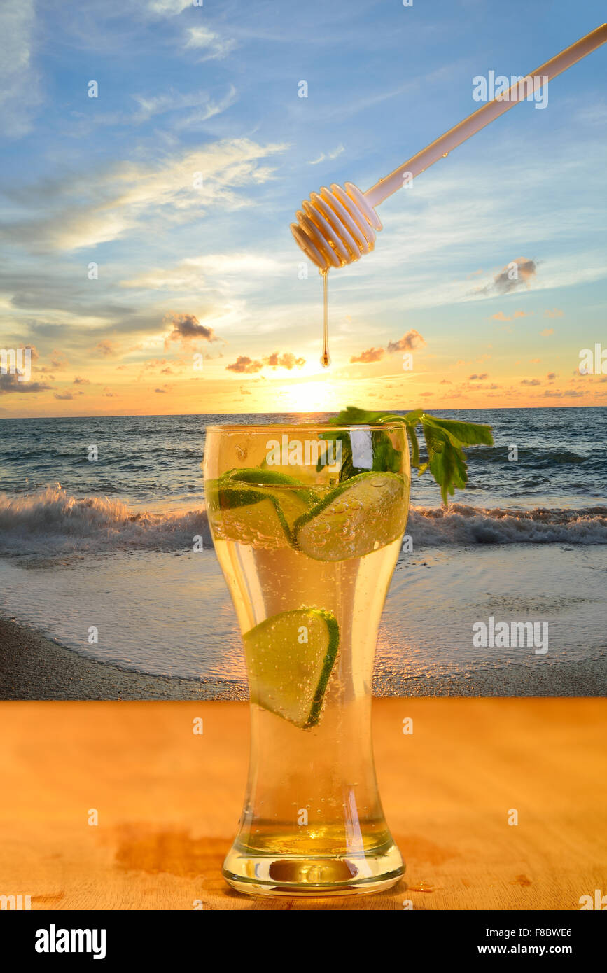 Mix lemon juice with honey background evening sky and sunset Stock ...