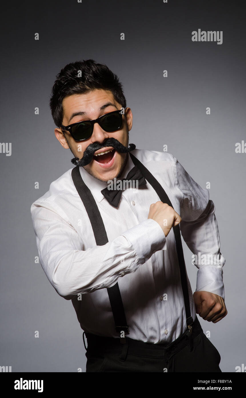Young man in cool sunglasses isolated on gray Stock Photo - Alamy