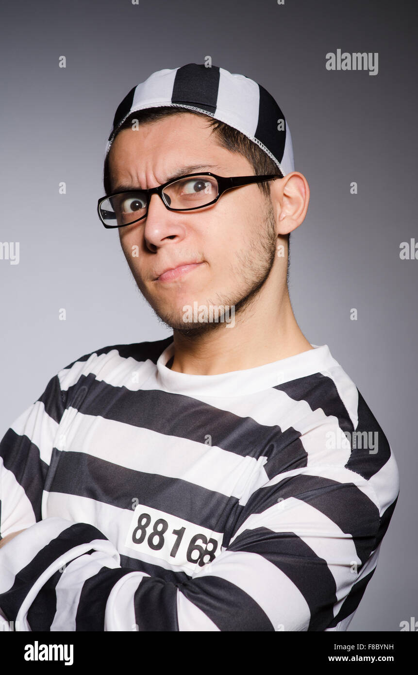 Funny prisoner isolated on gray Stock Photo - Alamy
