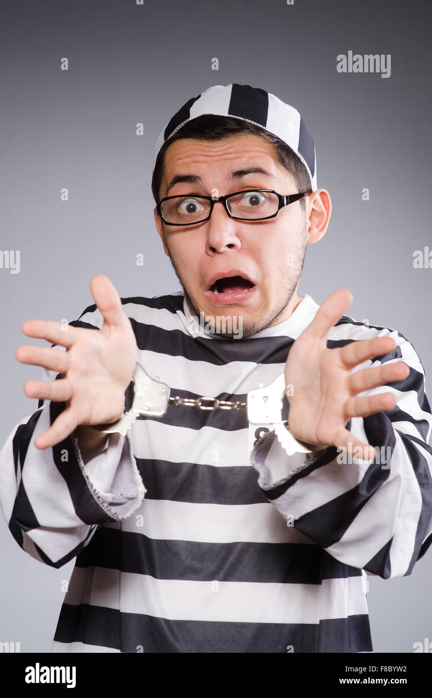 Funny prisoner isolated on gray Stock Photo - Alamy