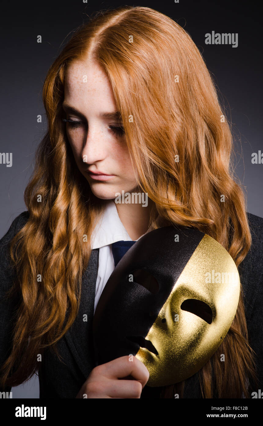 Woman with mask in hypocrisy concept Stock Photo - Alamy