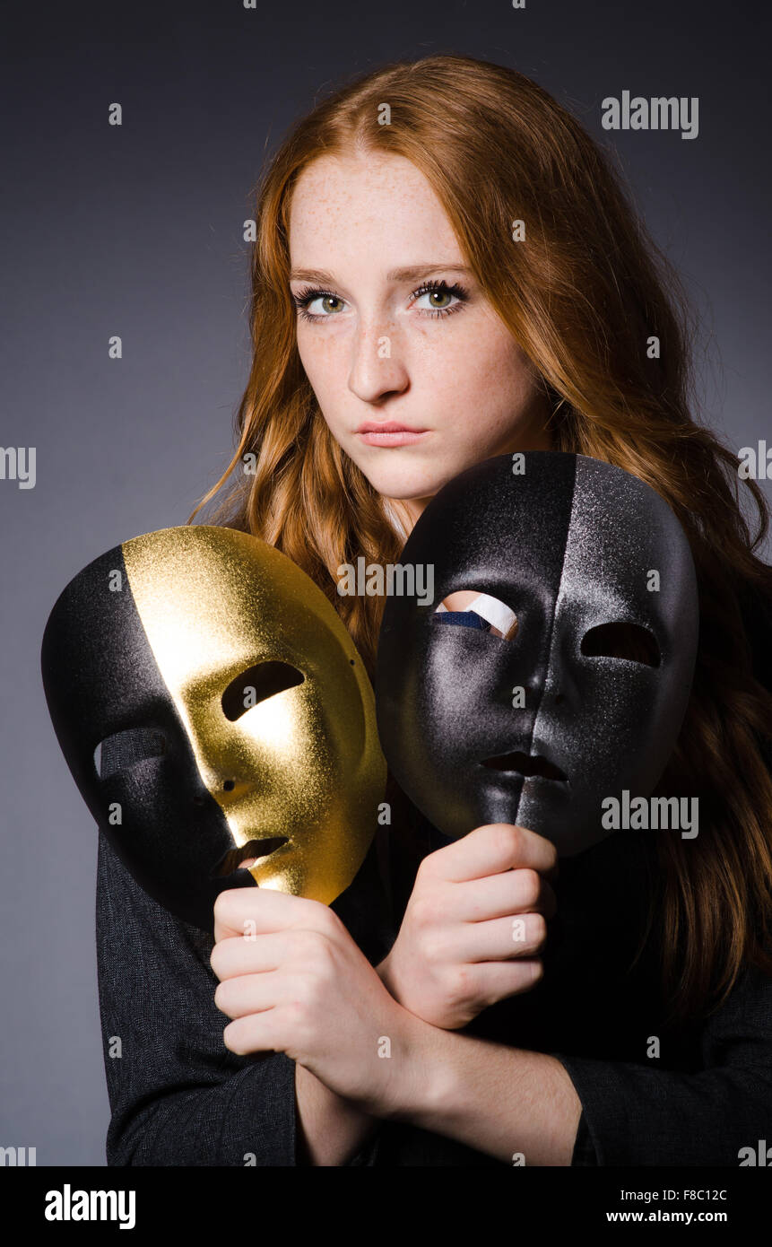 Woman with mask in hypocrisy concept Stock Photo - Alamy