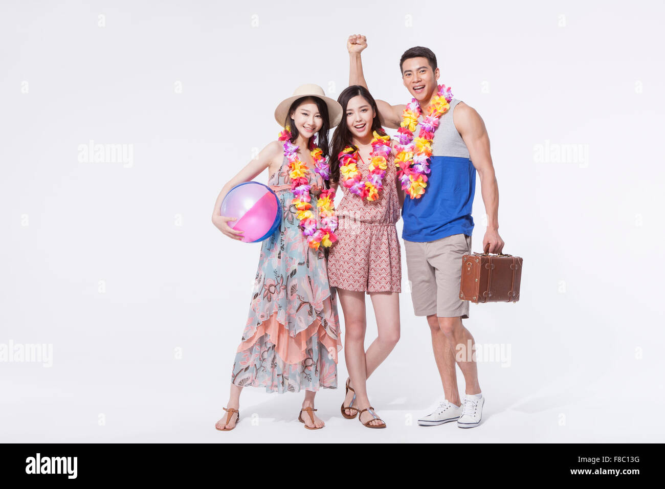 Two woman and a man staring forward with a smile being about to have ...