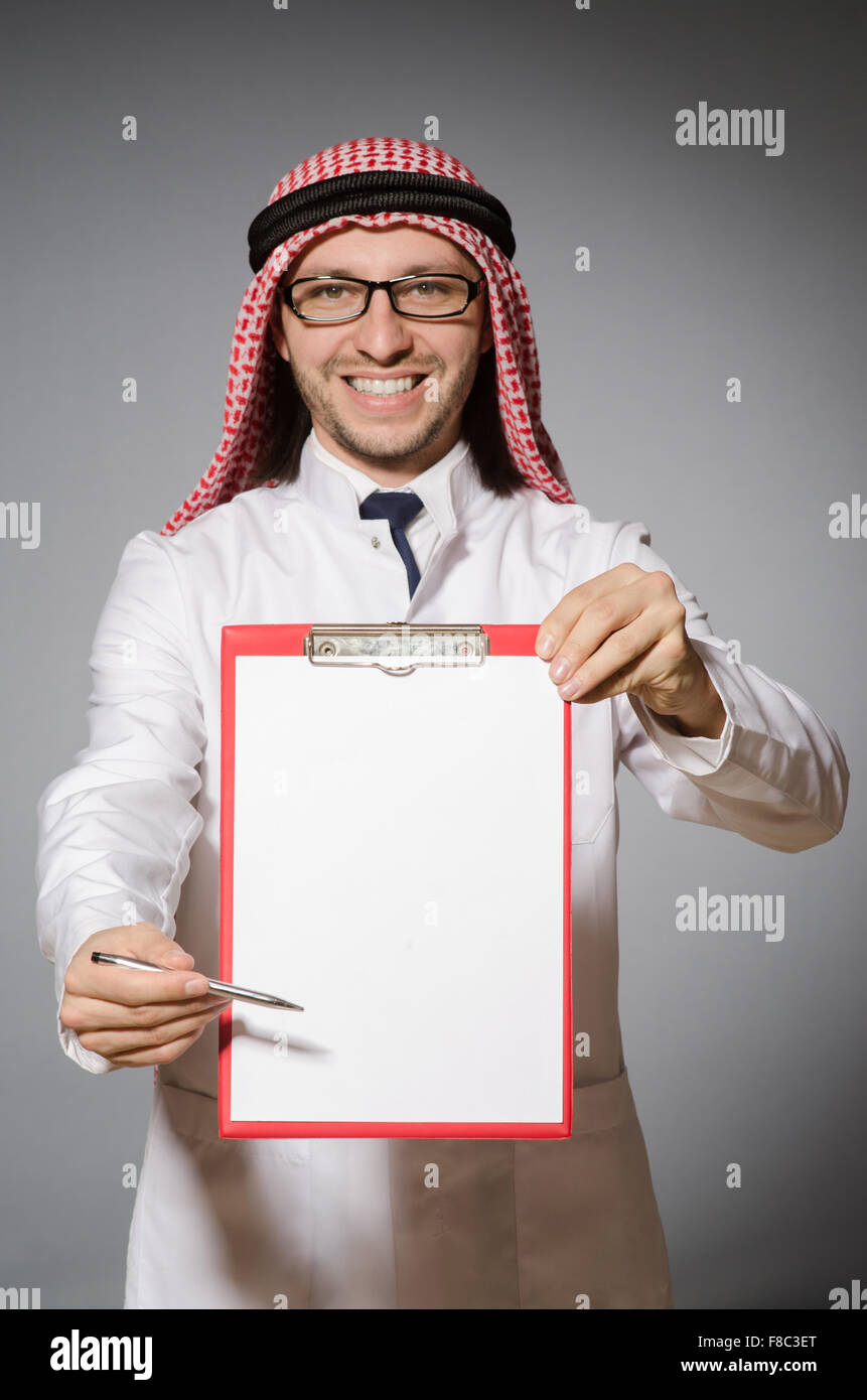 Arab man with paper binder Stock Photo - Alamy