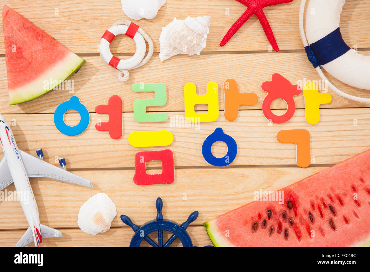 Korean word meaning Summer vacation on wood background surrounded by ...