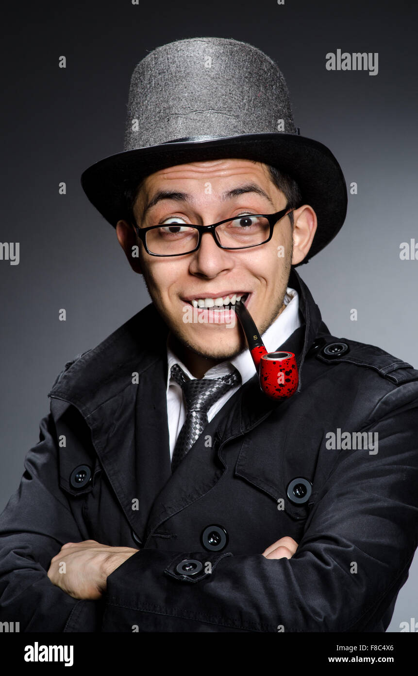 Funny detective with pipe and hat Stock Photo - Alamy