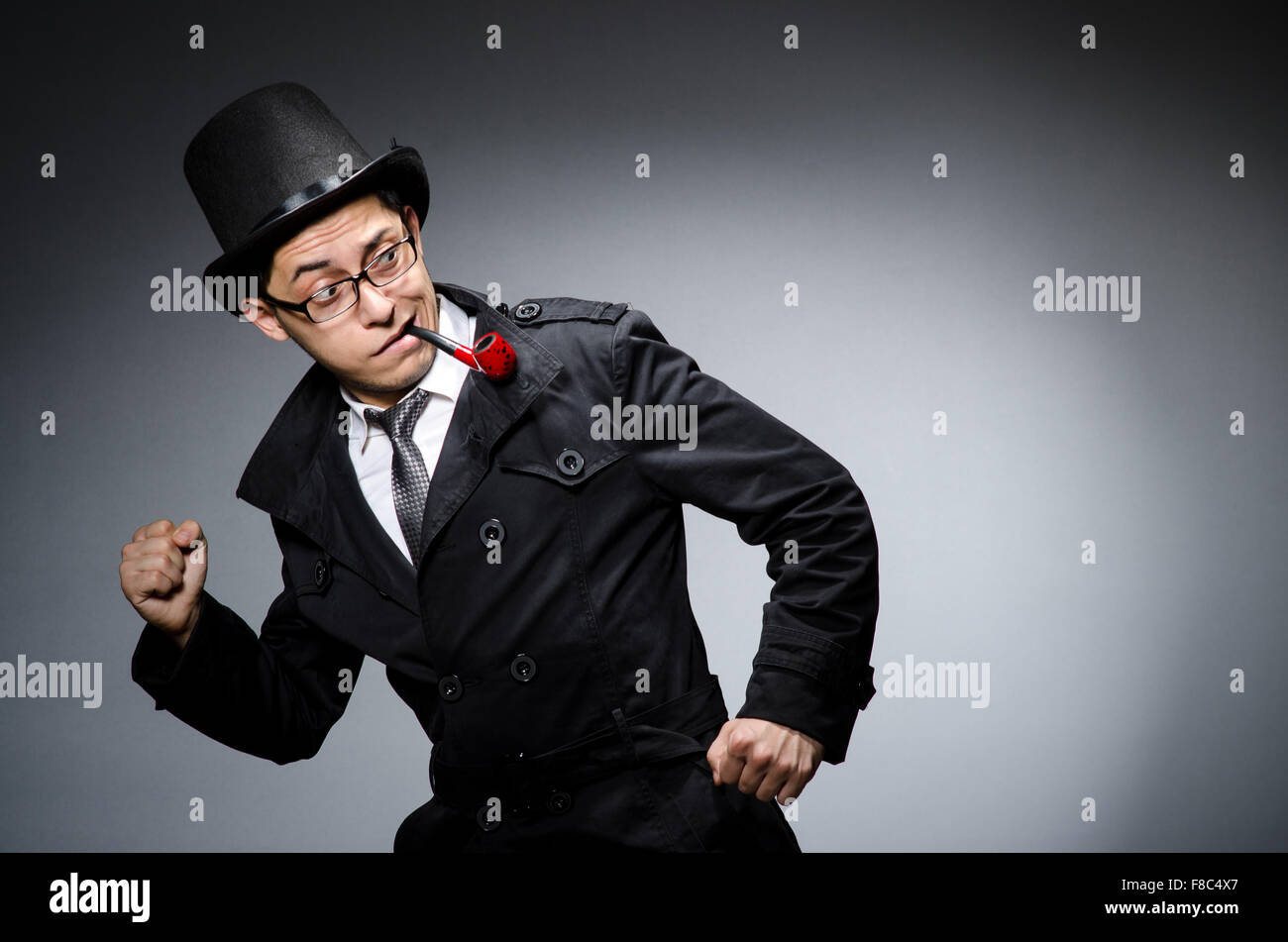 Funny detective with pipe and hat Stock Photo - Alamy