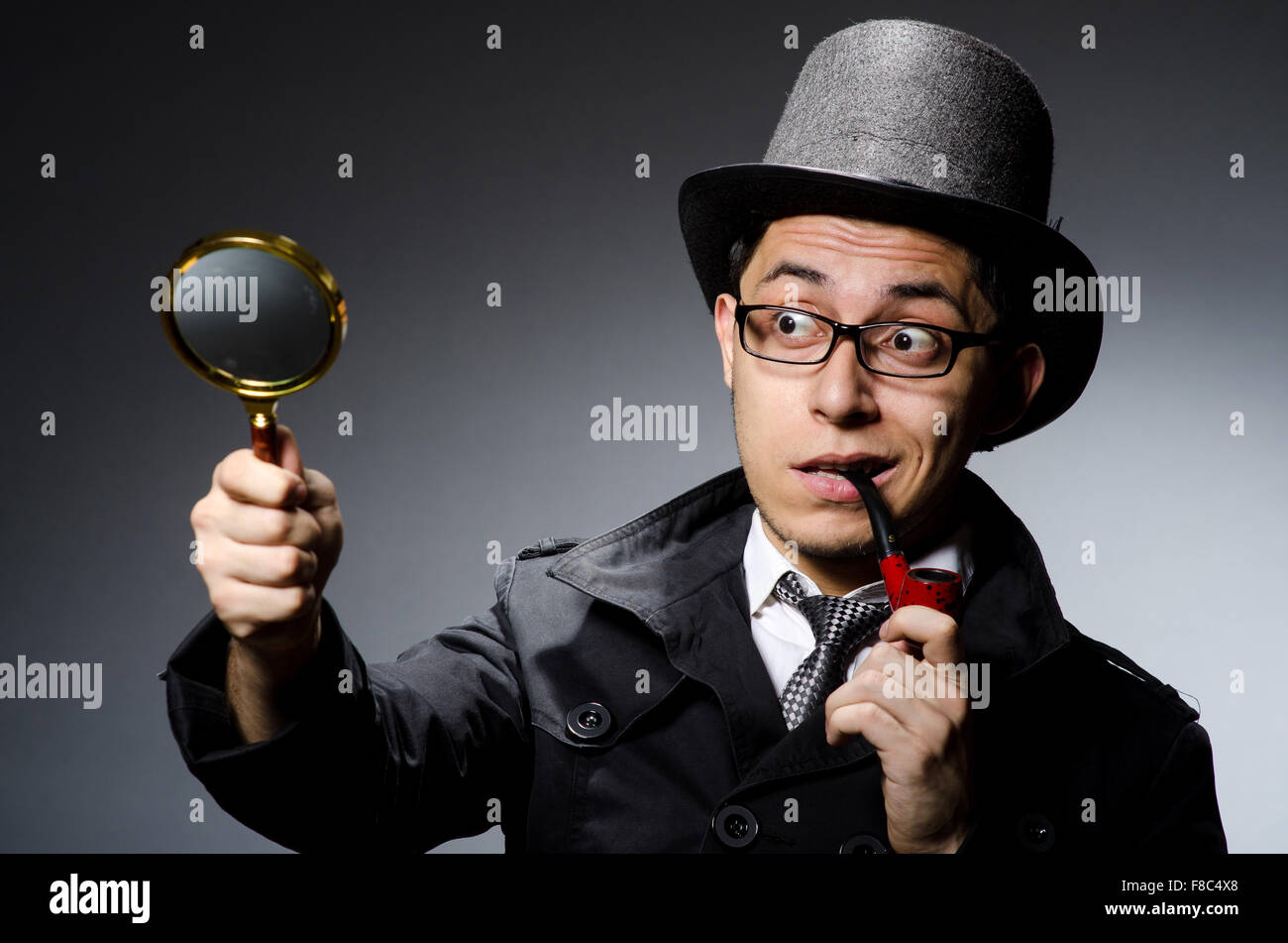 Funny detective with pipe and hat Stock Photo - Alamy