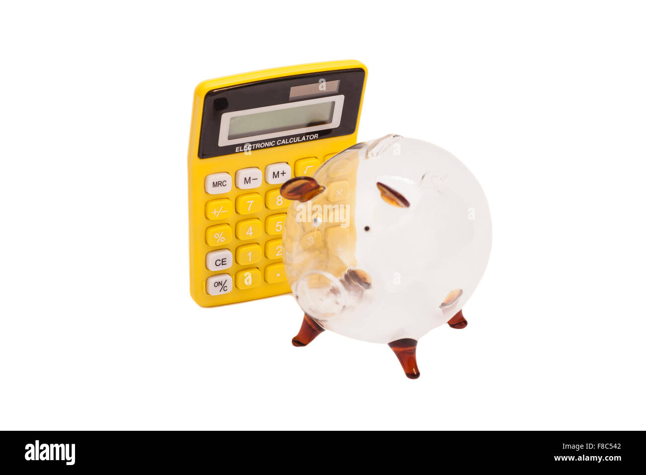 Piggy bank and calculator isolated on white background Stock Photo - Alamy