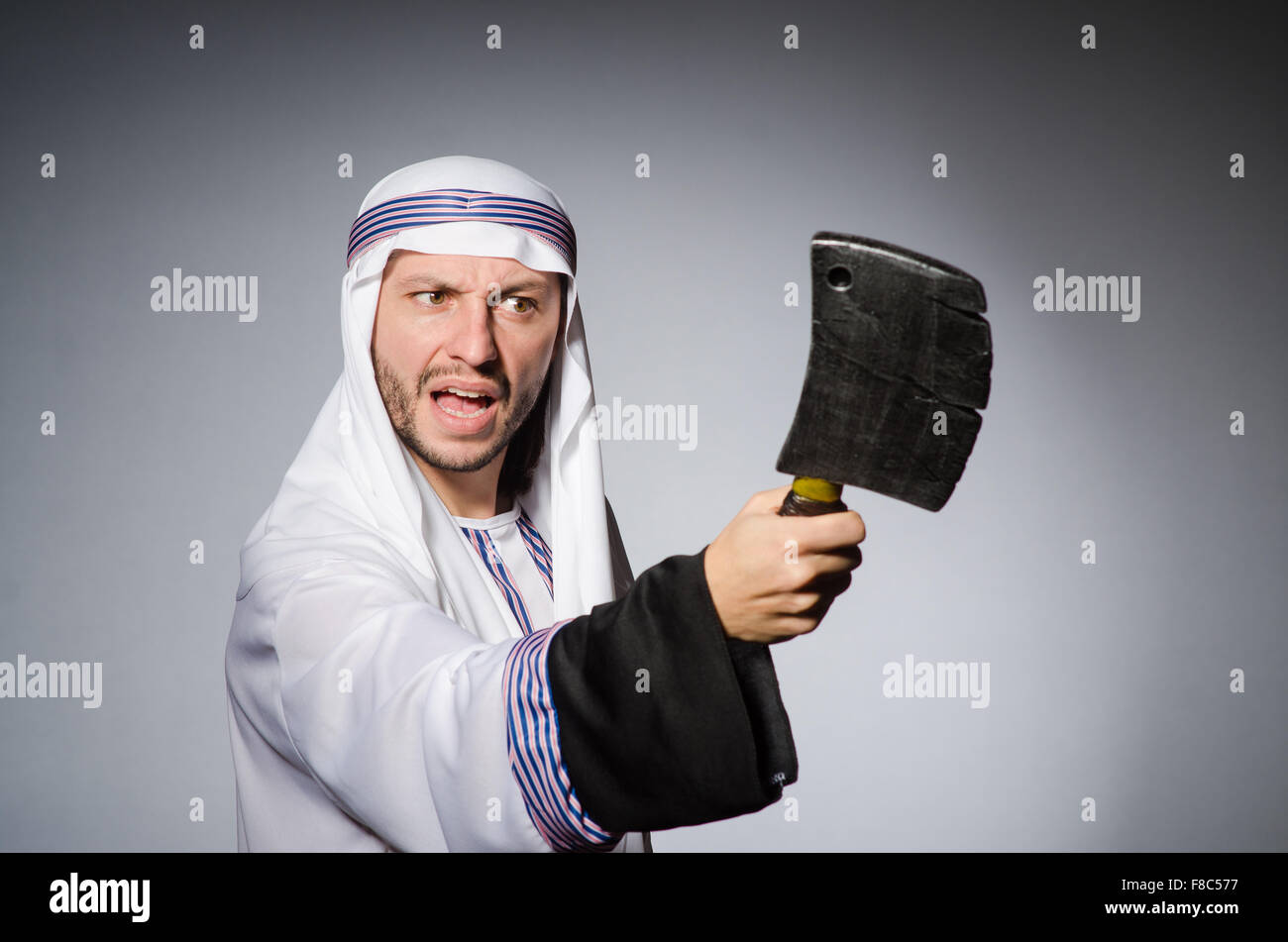 Arab man with sharp axe Stock Photo - Alamy