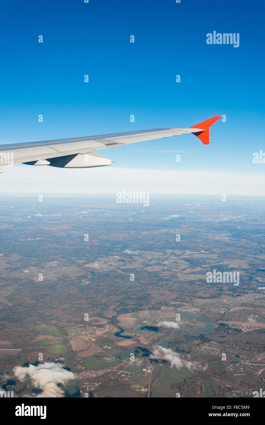 Airplane wing out of window Stock Photo - Alamy