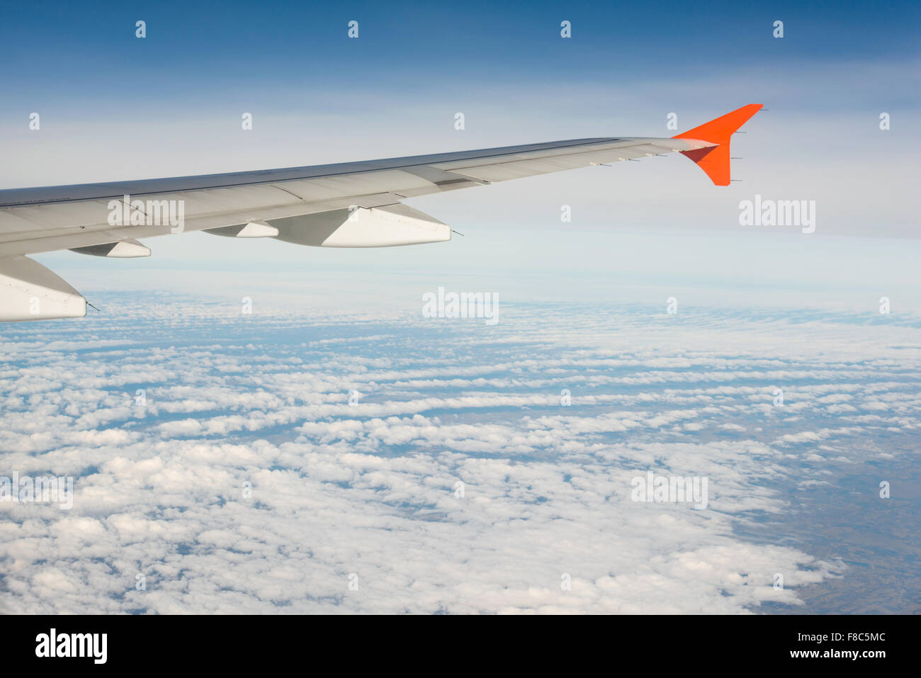 Airplane wing out of window Stock Photo - Alamy