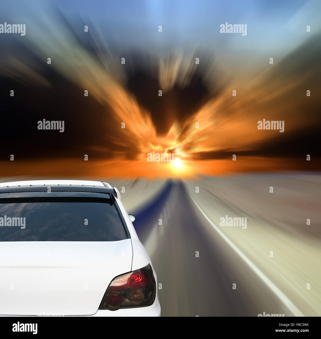 Red car on desert road under sunset sky Stock Photo - Alamy