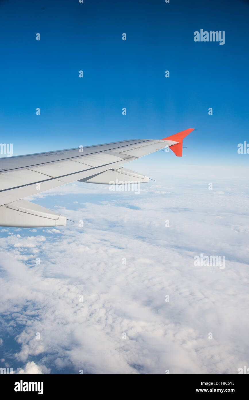 Airplane wing out of window Stock Photo - Alamy