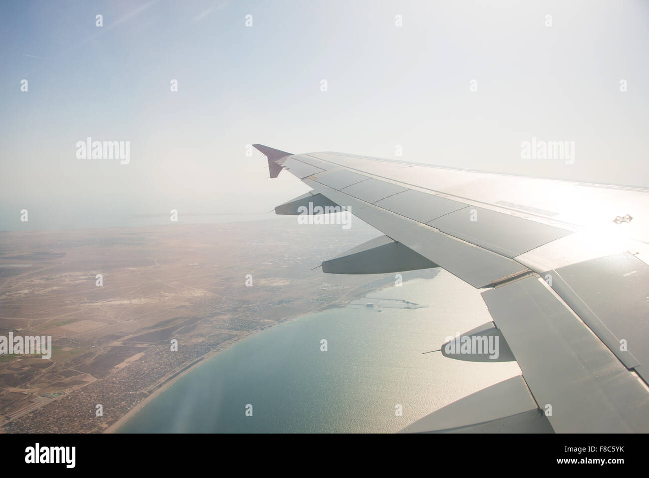 Airplane wing out of window Stock Photo - Alamy