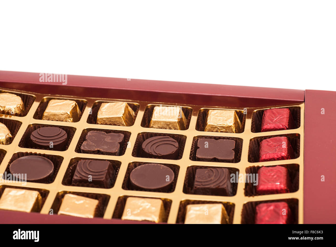 Box of chocolate candies isolated on white Stock Photo - Alamy