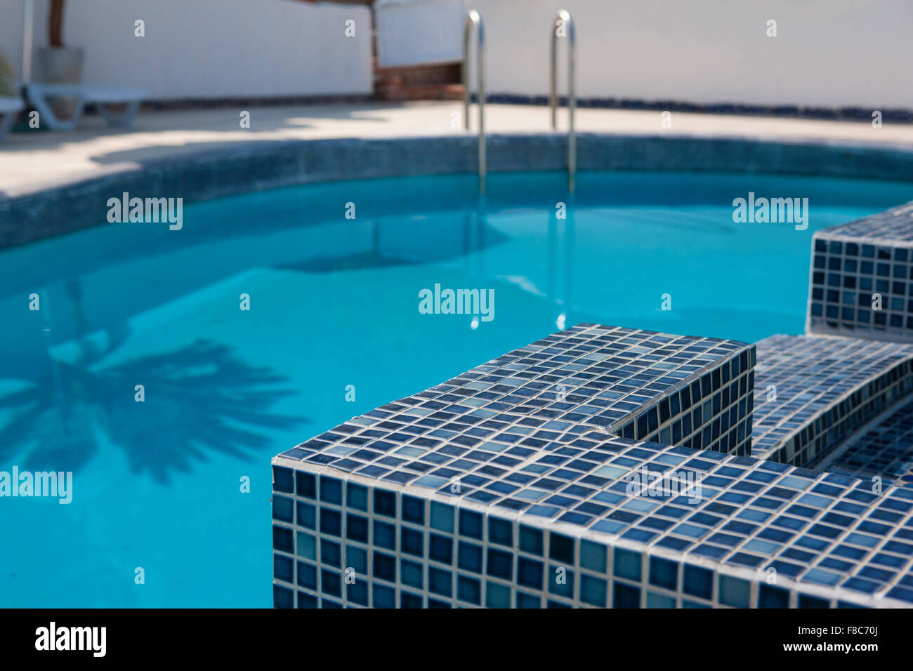 Outdoor swimming pool with the corner of tiles Stock Photo - Alamy
