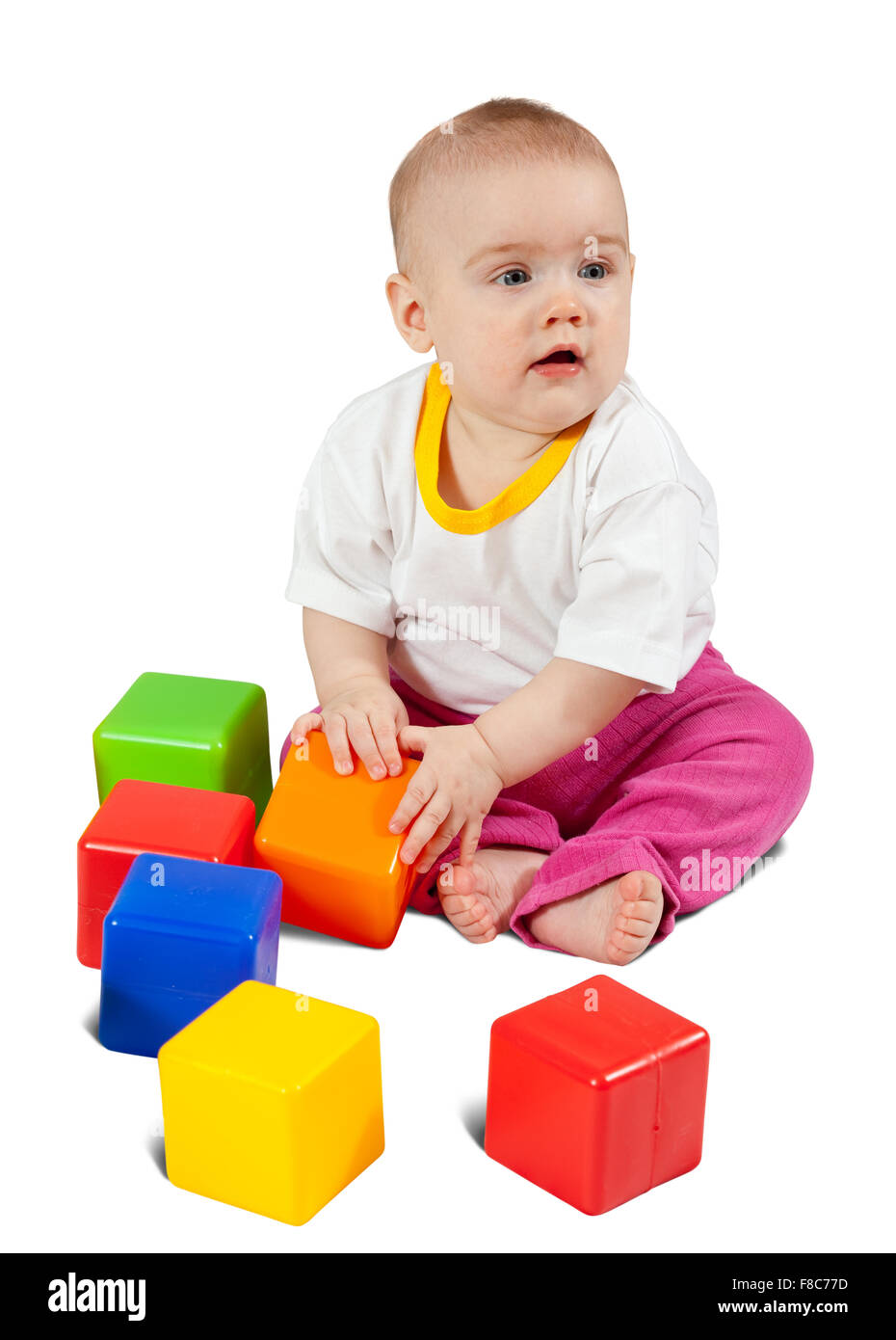 Baby girl plays with toy blocks over white background Stock Photo - Alamy