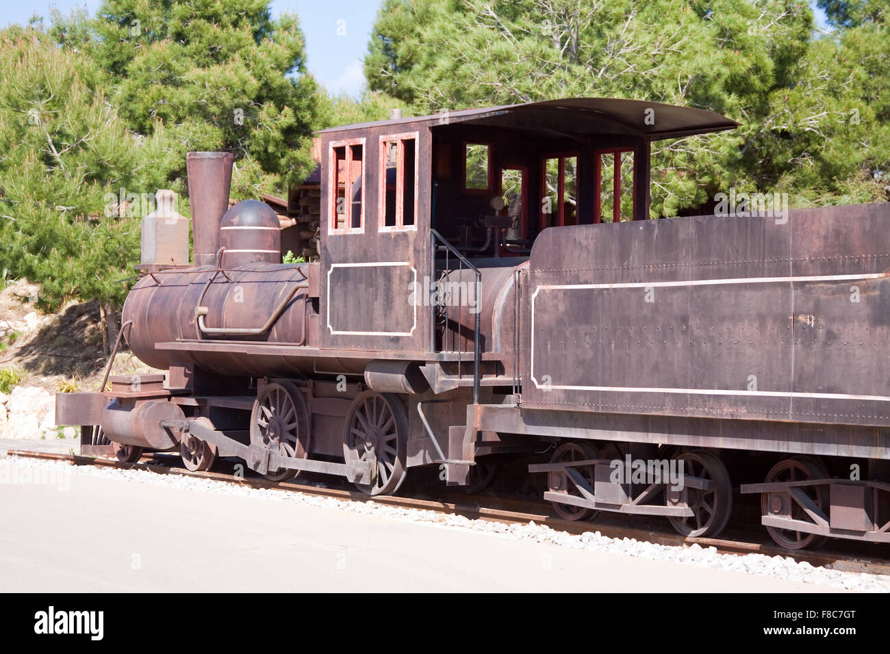 Old steam locomotive against pine trees Stock Photo - Alamy