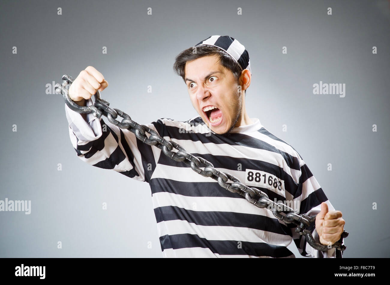 Funny prison inmate in concept Stock Photo - Alamy
