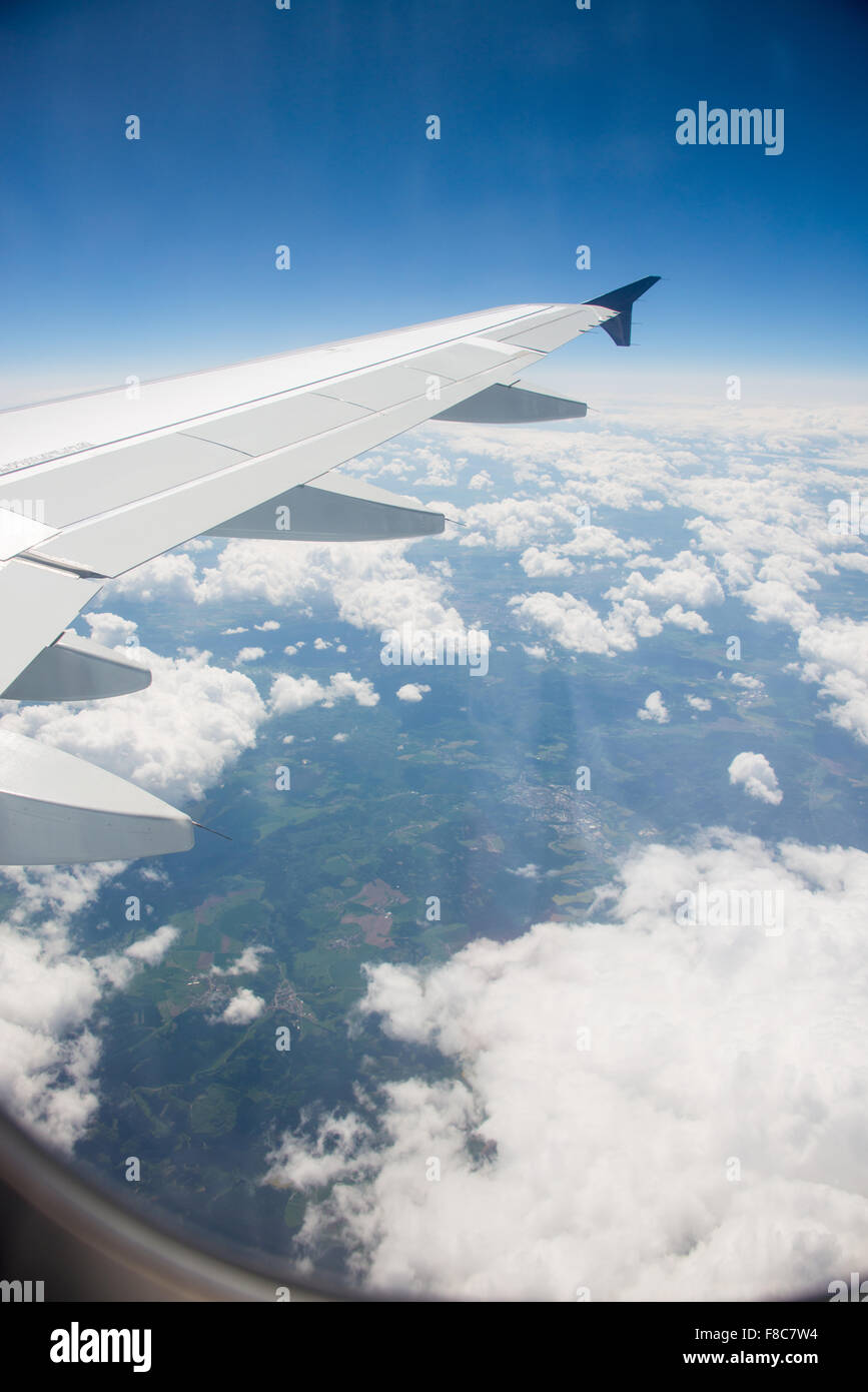 Airplane wing out of window Stock Photo - Alamy