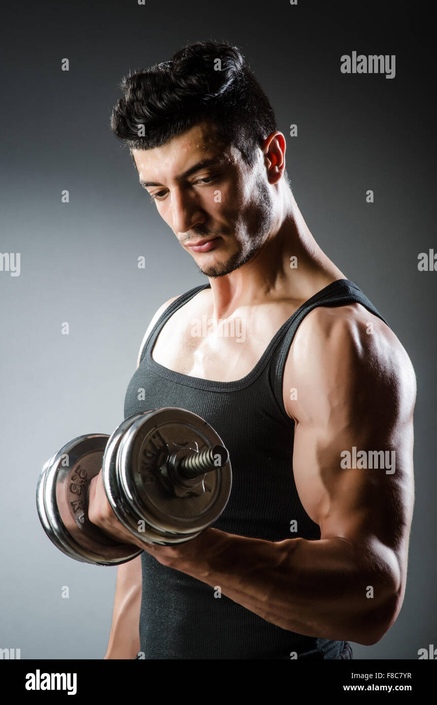 Muscular ripped bodybuilder with dumbbells Stock Photo - Alamy