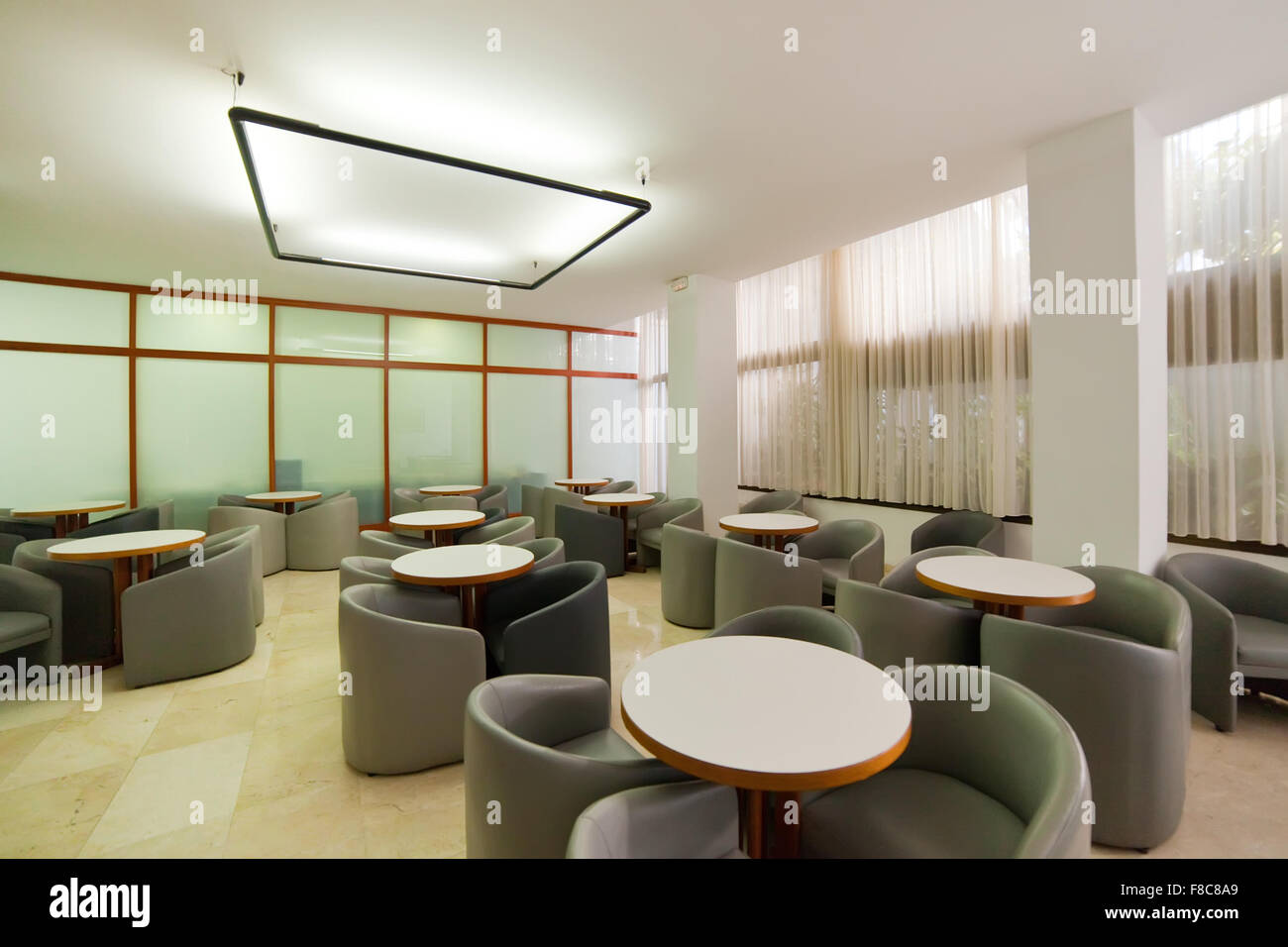 Interior of comfortable cafe with leather arm-chair Stock Photo - Alamy