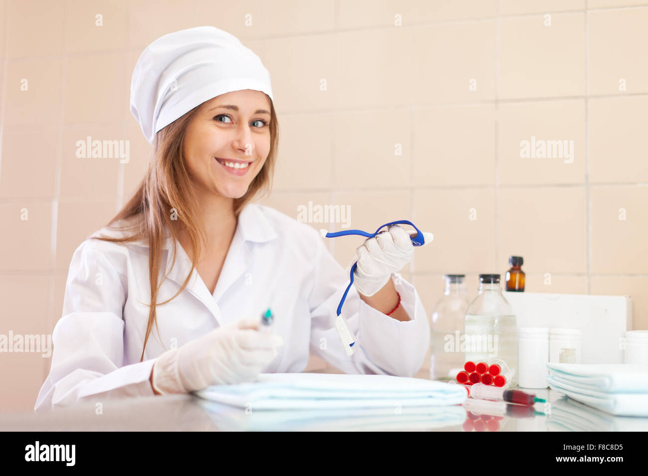 Positive nurse prepares to take blood sample in laboratory Stock Photo ...