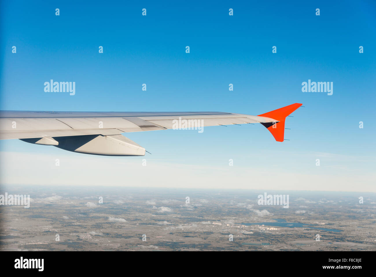 Airplane wing out of window Stock Photo - Alamy