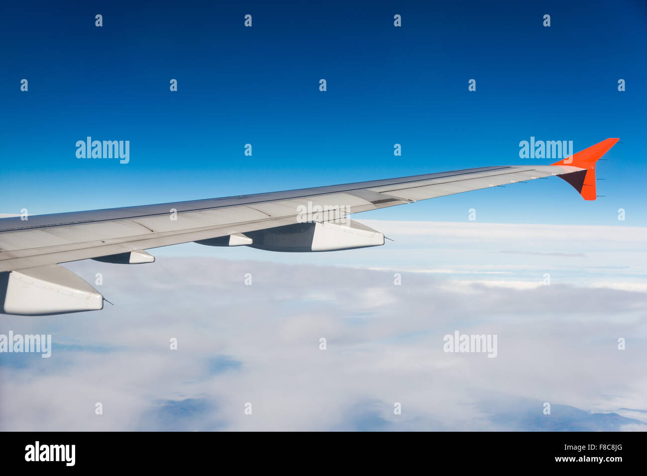 Airplane wing out of window Stock Photo - Alamy