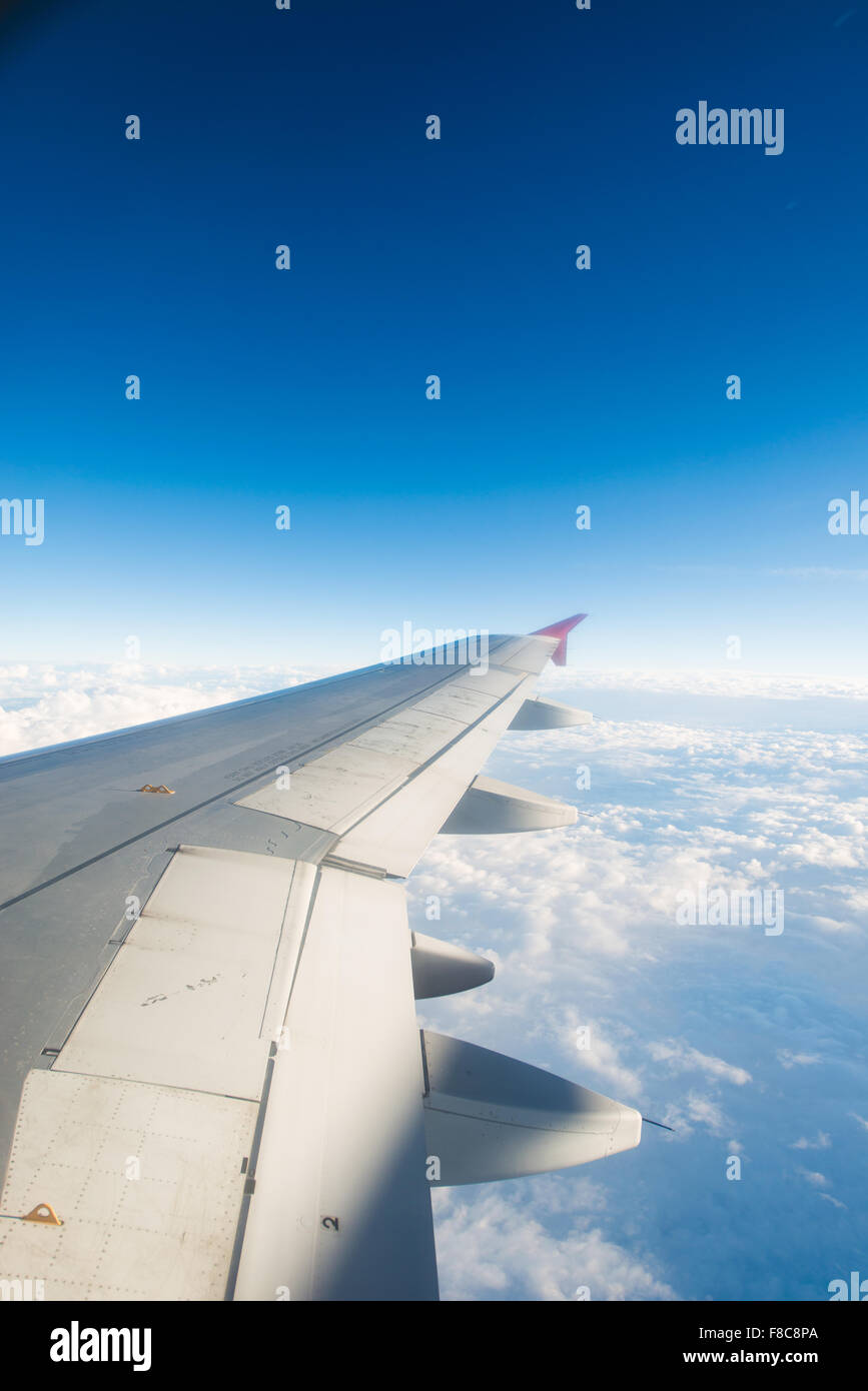 Airplane wing out of window Stock Photo - Alamy
