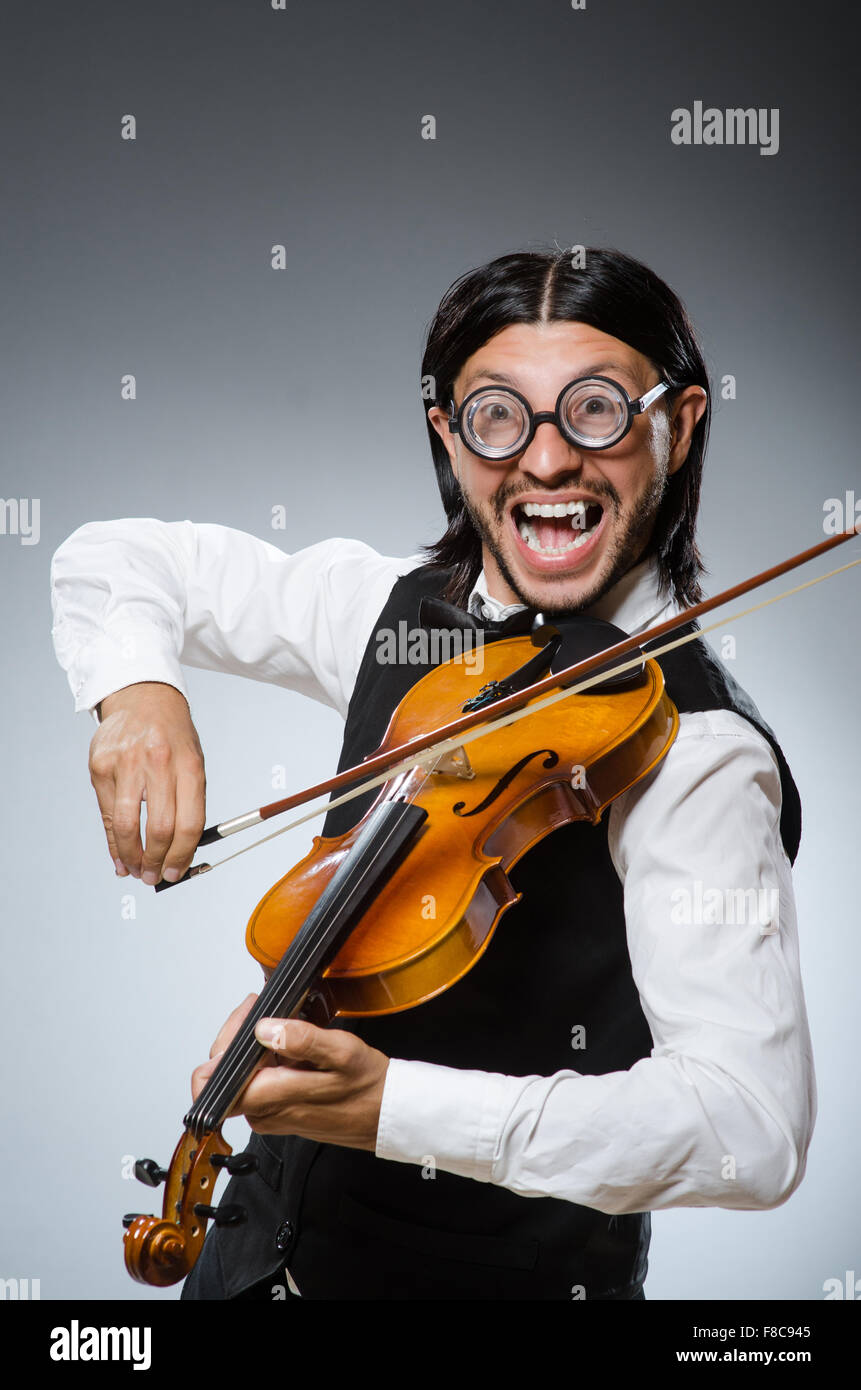 Funny fiddle violin player in musical concept Stock Photo - Alamy