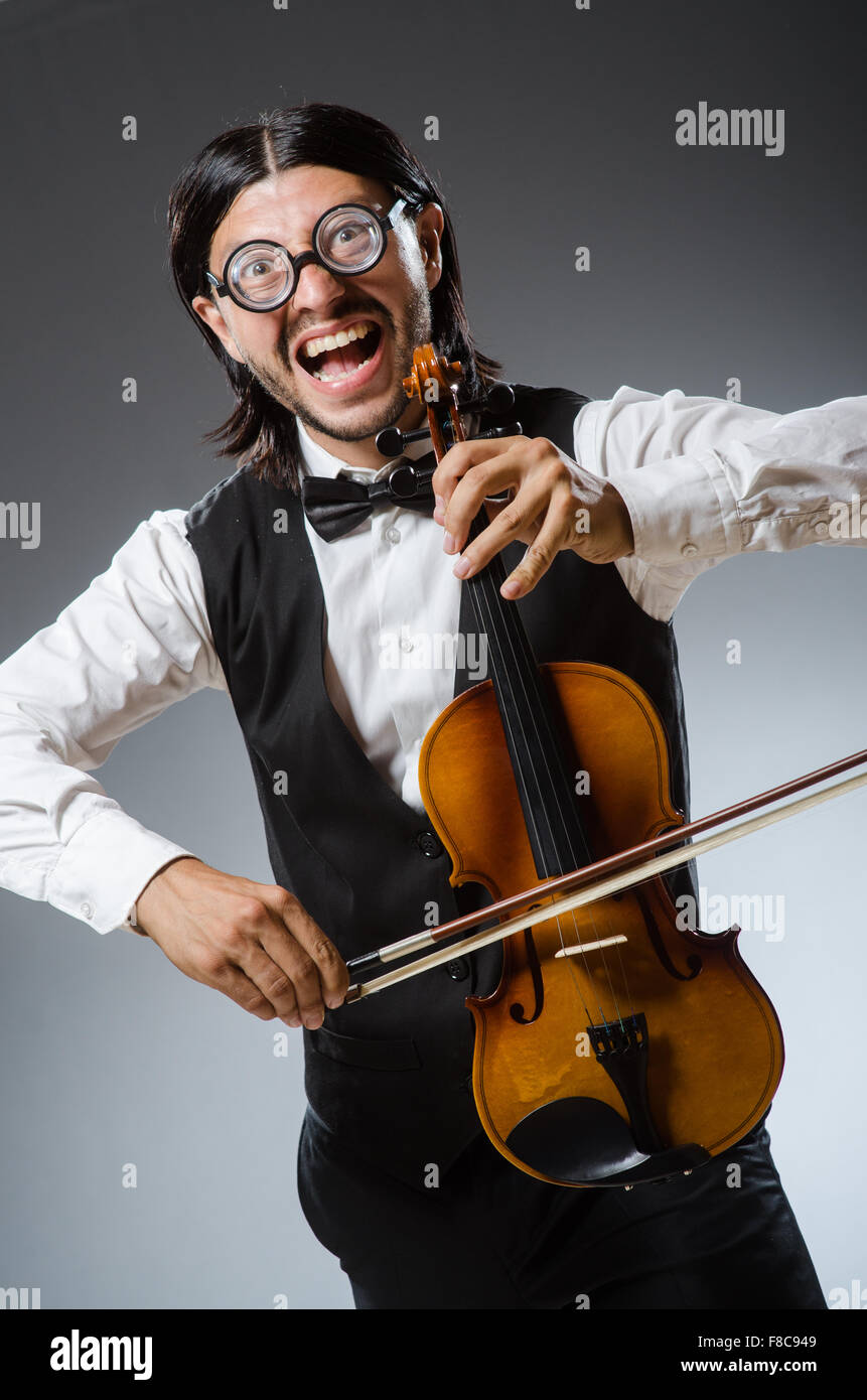Funny fiddle violin player in musical concept Stock Photo - Alamy