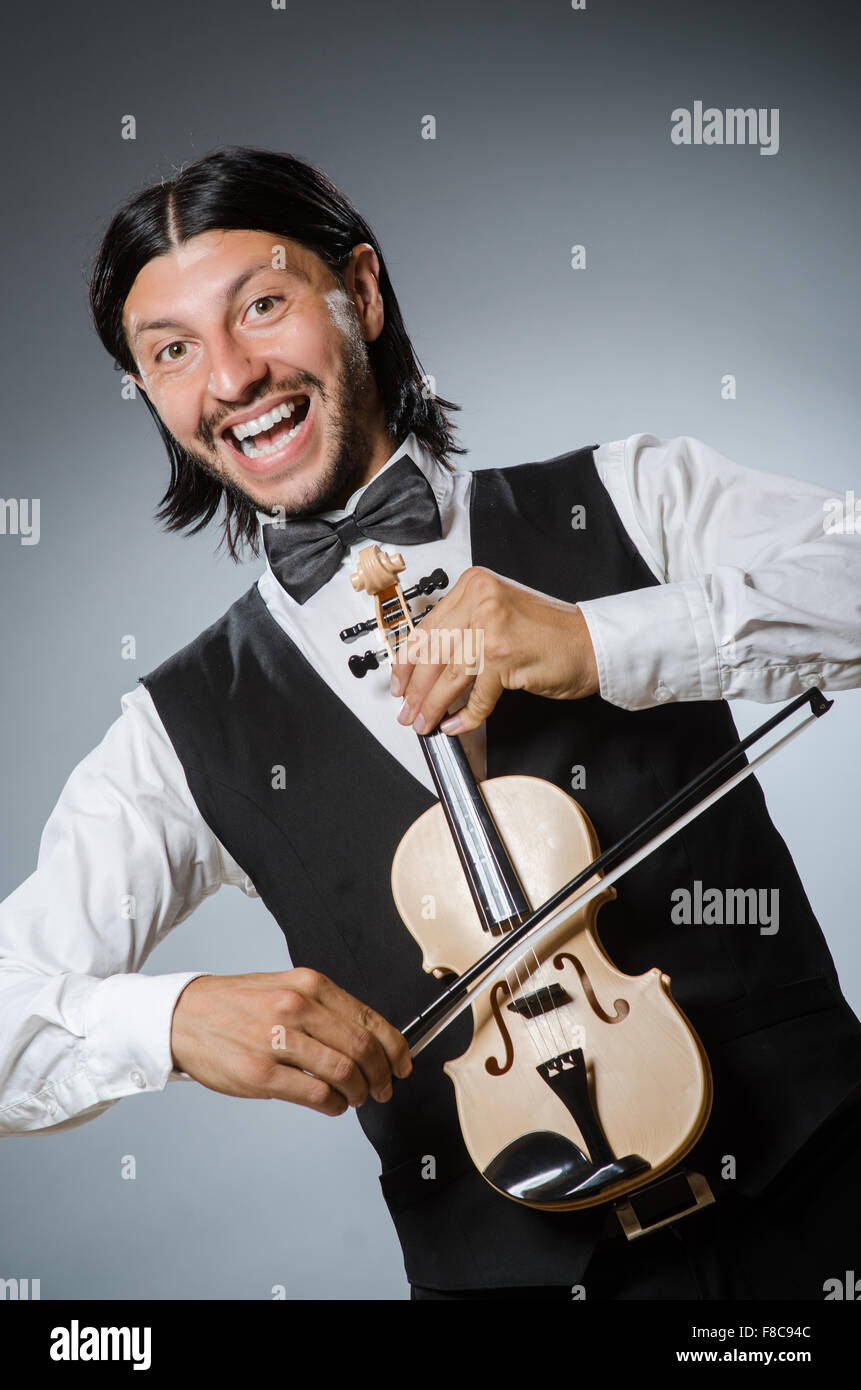 Funny fiddle violin player in musical concept Stock Photo - Alamy