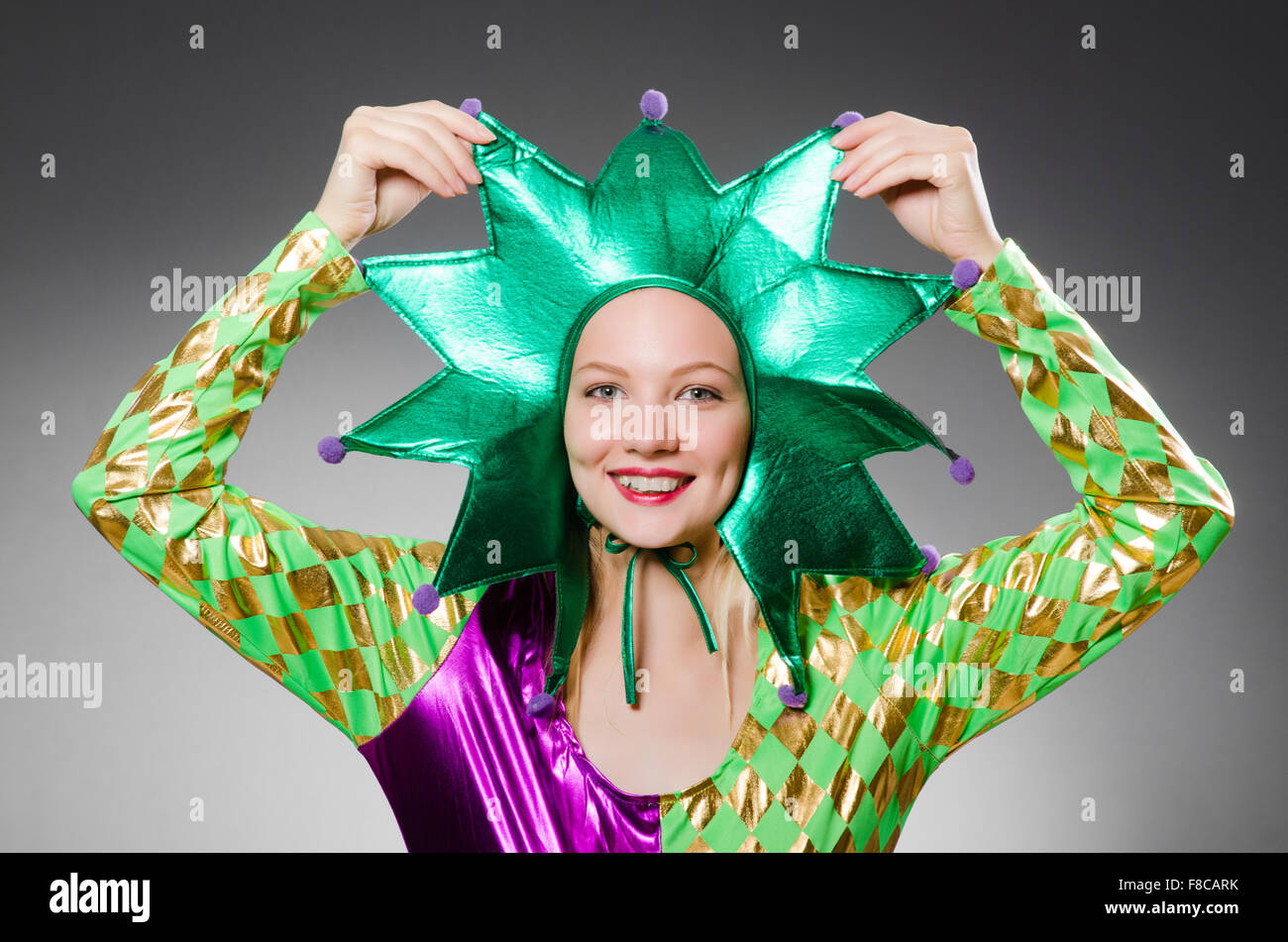 Funny clown in colourful costume Stock Photo - Alamy