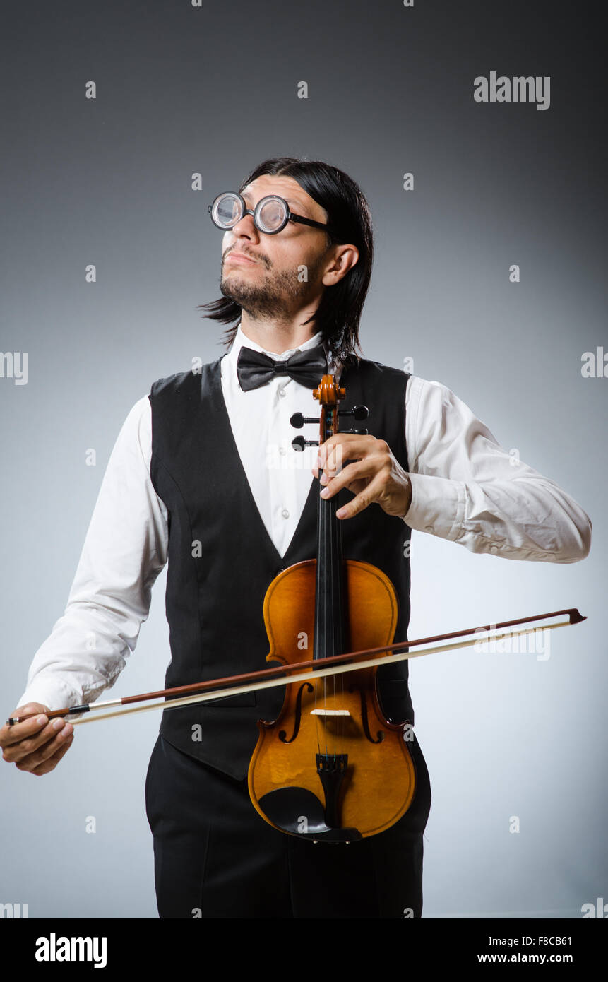 Funny fiddle violin player in musical concept Stock Photo - Alamy